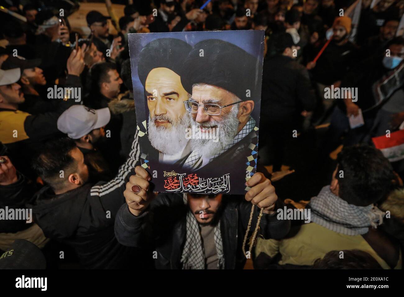 Baghdad, Iraq. 02nd Jan, 2021. Iraqi man carries a poster of the ...