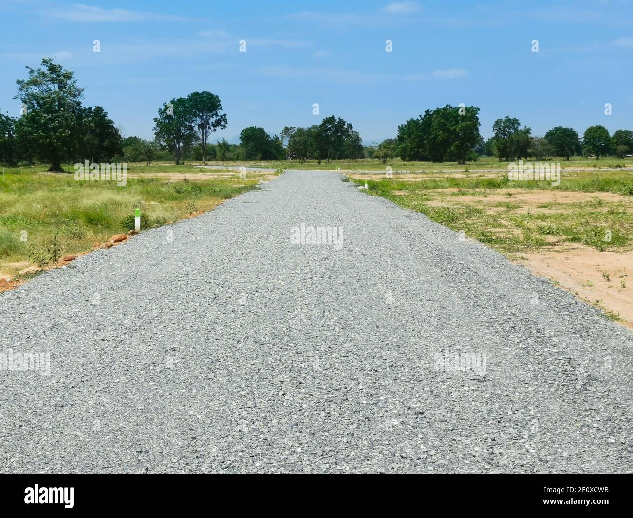 Gravel road in a country road. A wide shield rural area with no ...