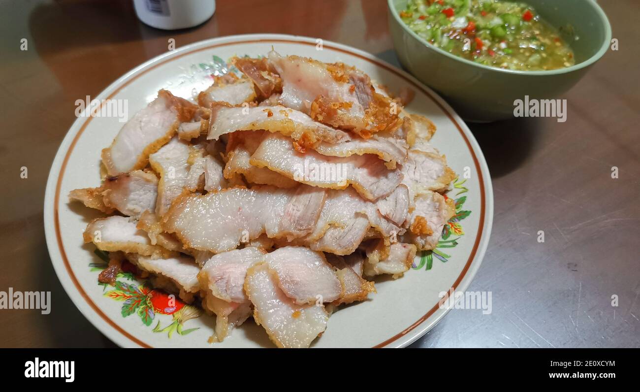 Deep fried pork belly with fish sauce, blurry seafood sauce in the ...