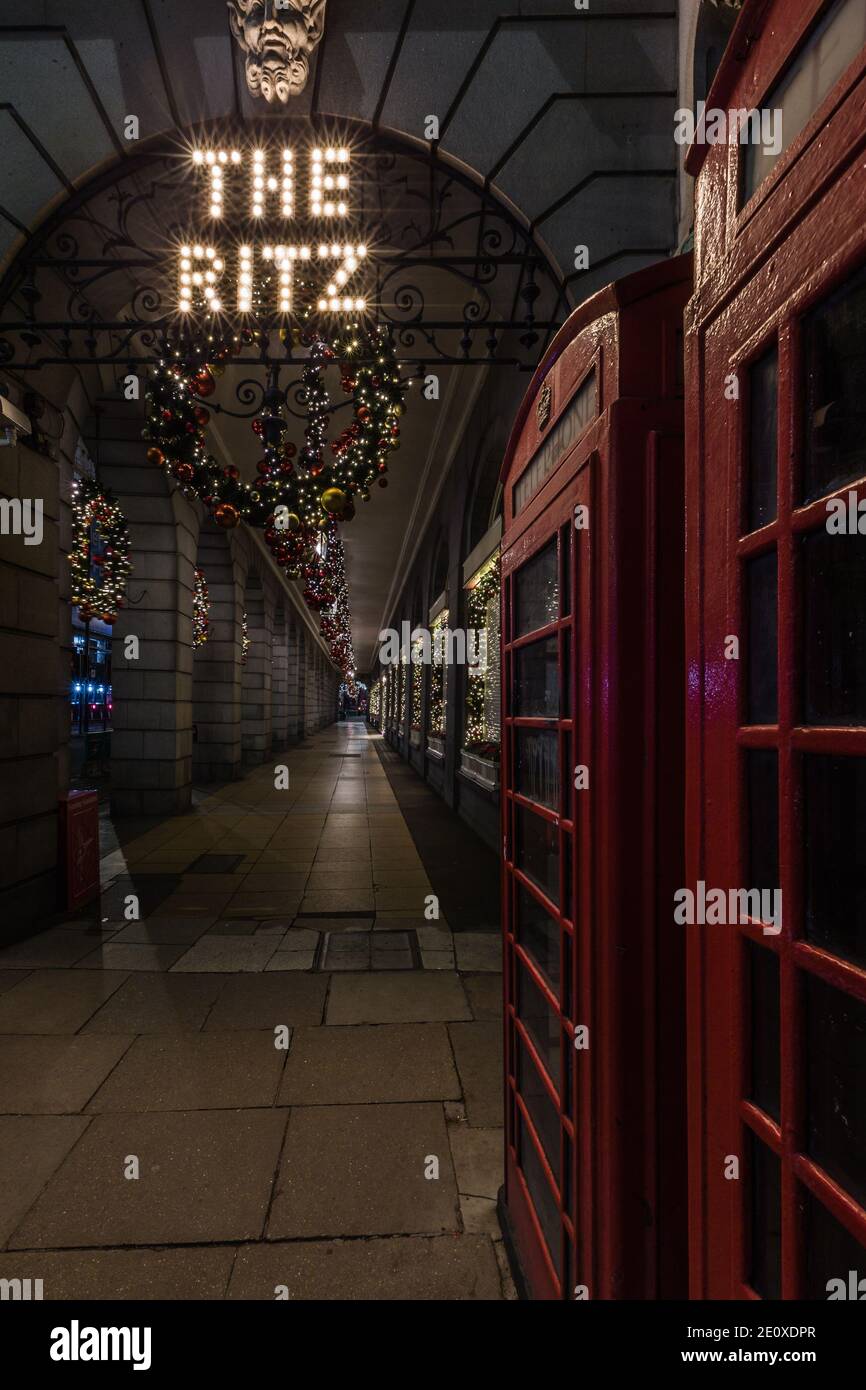 The Ritz Hotel and iconic red telephone boxes in London during the ...