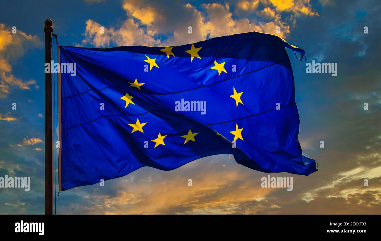 The European Union EU Flag Flies In The Wind At Sunset Stock Photo - Alamy