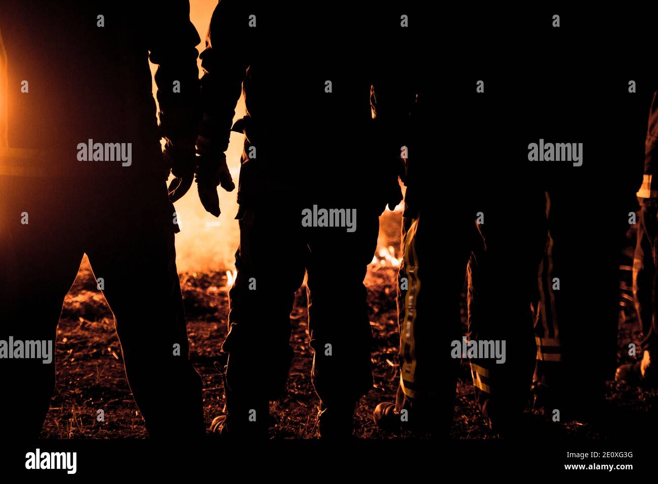 Firemen getting ready during a firefighting intervention Stock Photo ...