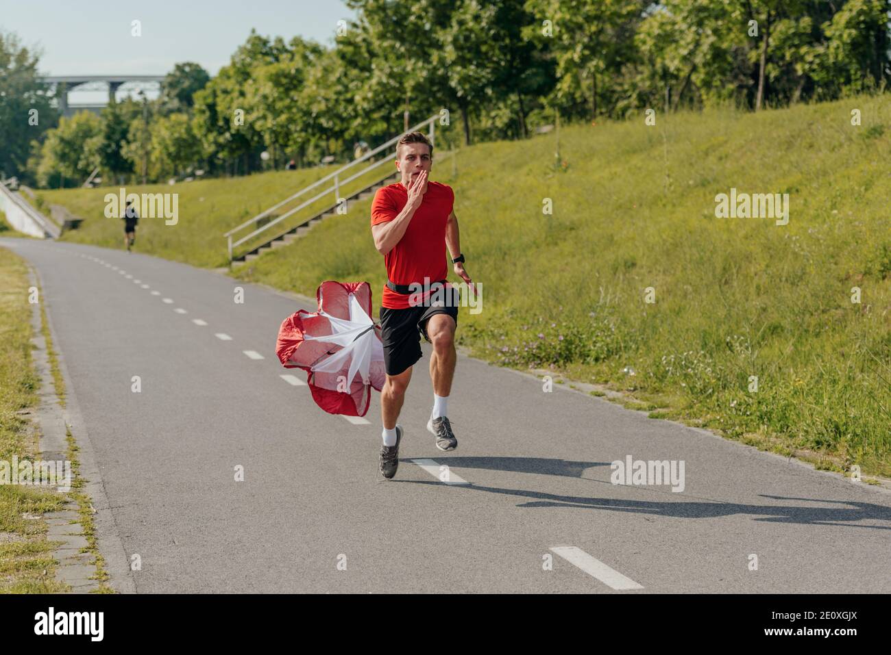 Athlete man running with parachute hi-res stock photography and images ...