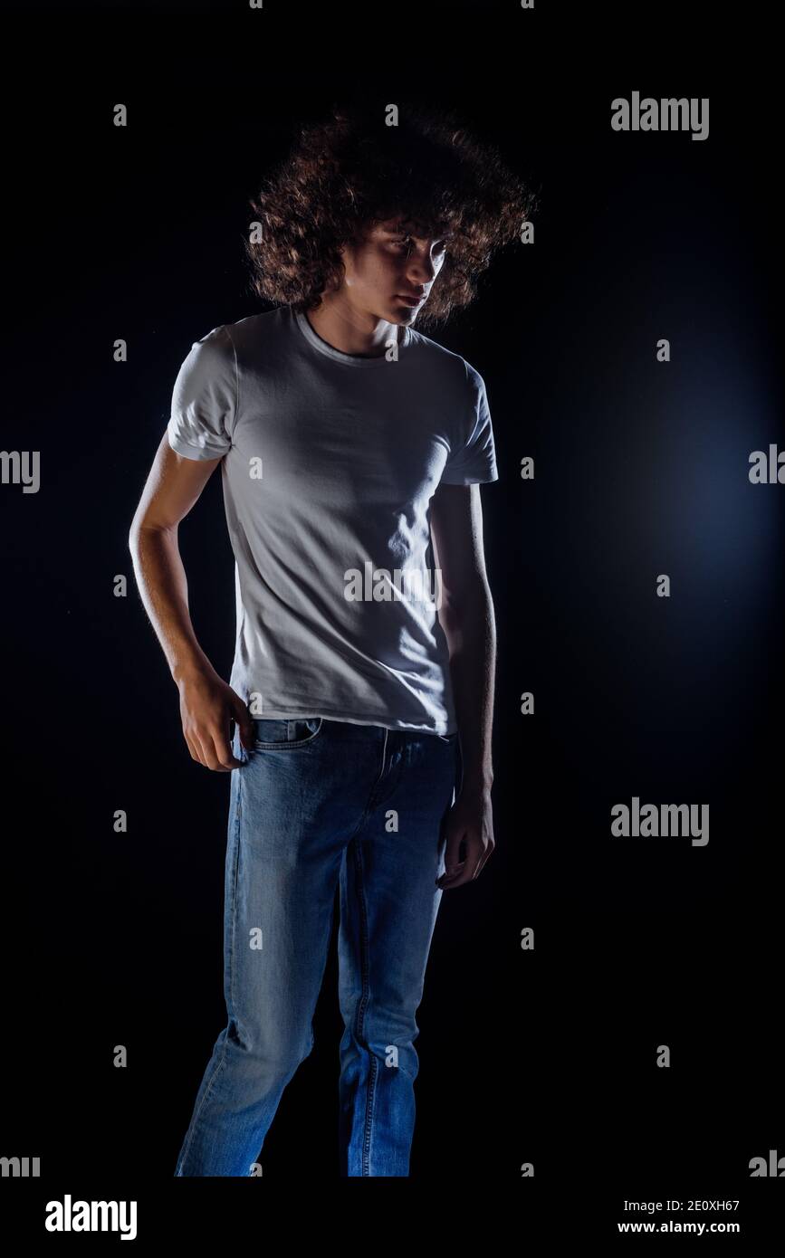 Fashion model posing wearing rock clothing isolated on black wall Stock ...