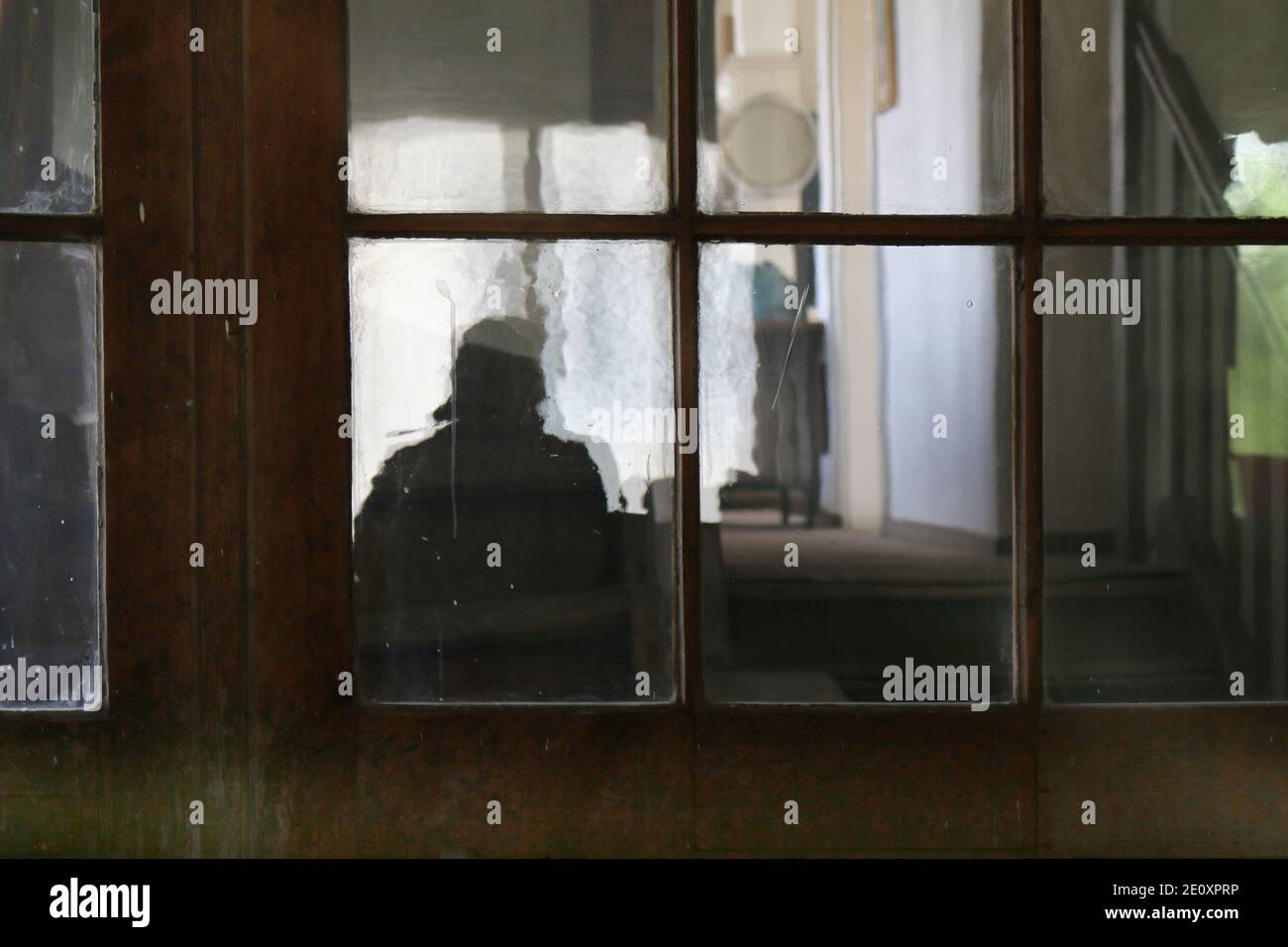 Shadow Behind The Window Stock Photo - Alamy