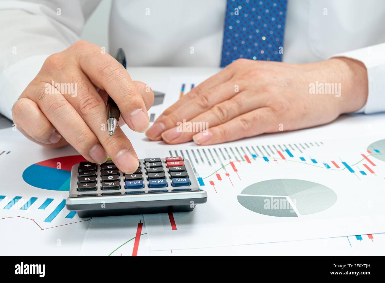 Workplace businessman. Charts, and graphs on the desk. Business ...