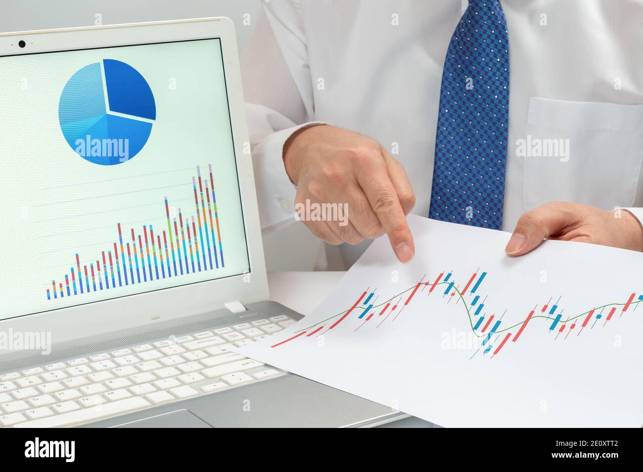 Businessman analyzing charts on hi-res stock photography and images - Alamy