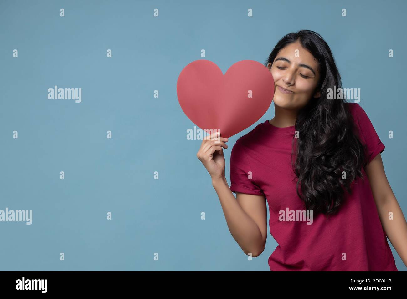 Mexican Latin girl holding a red heart, Valentine's day, self love ...