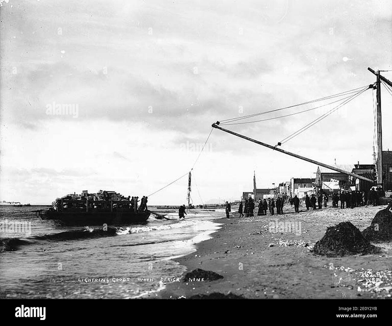 Lightering goods from a scow onto the beach, Nome, Alaska, ca 1900 ...