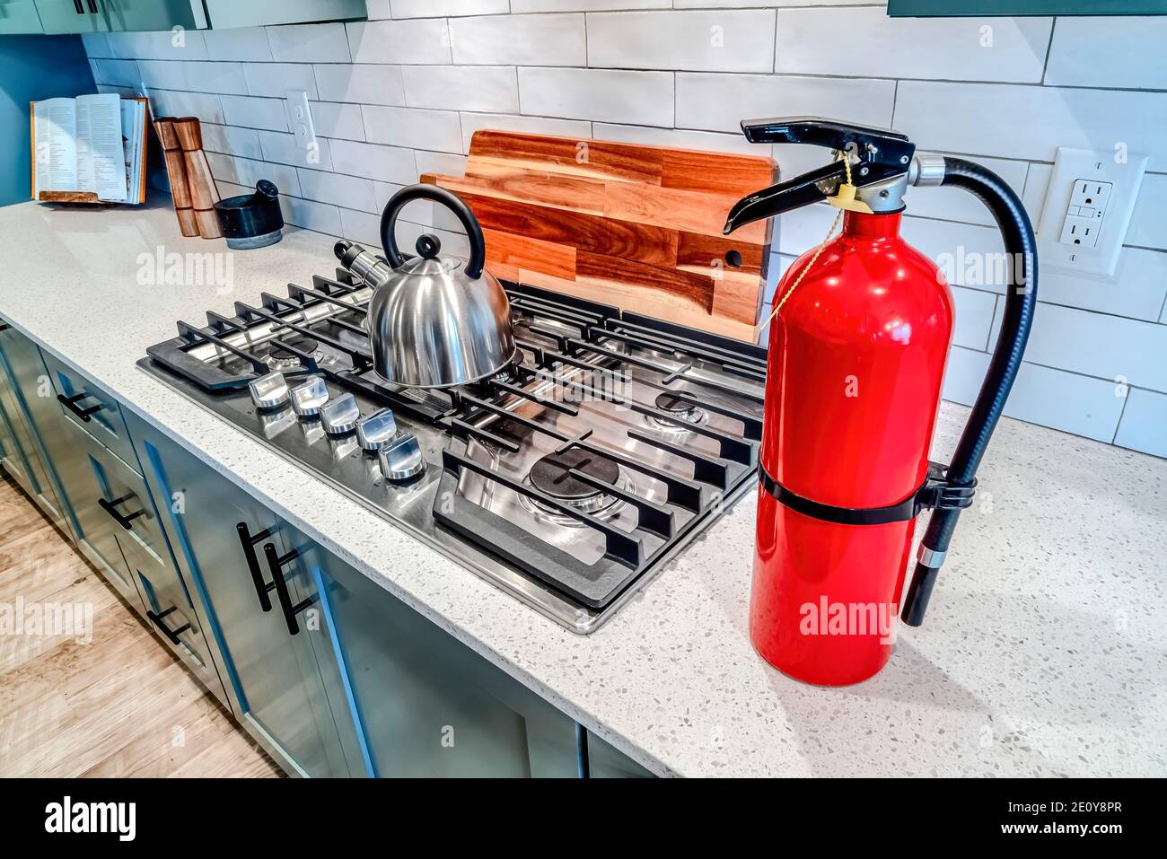 Home kitchen with fire extinguisher and built in cooking unit on the ...