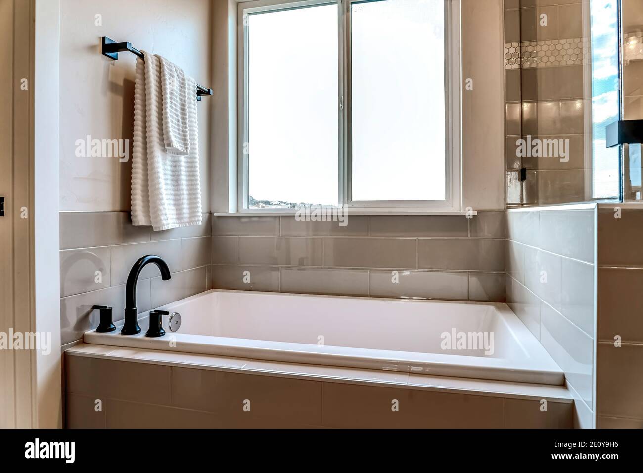 Bathroom interior with built in rectangular bathtub by the sliding ...