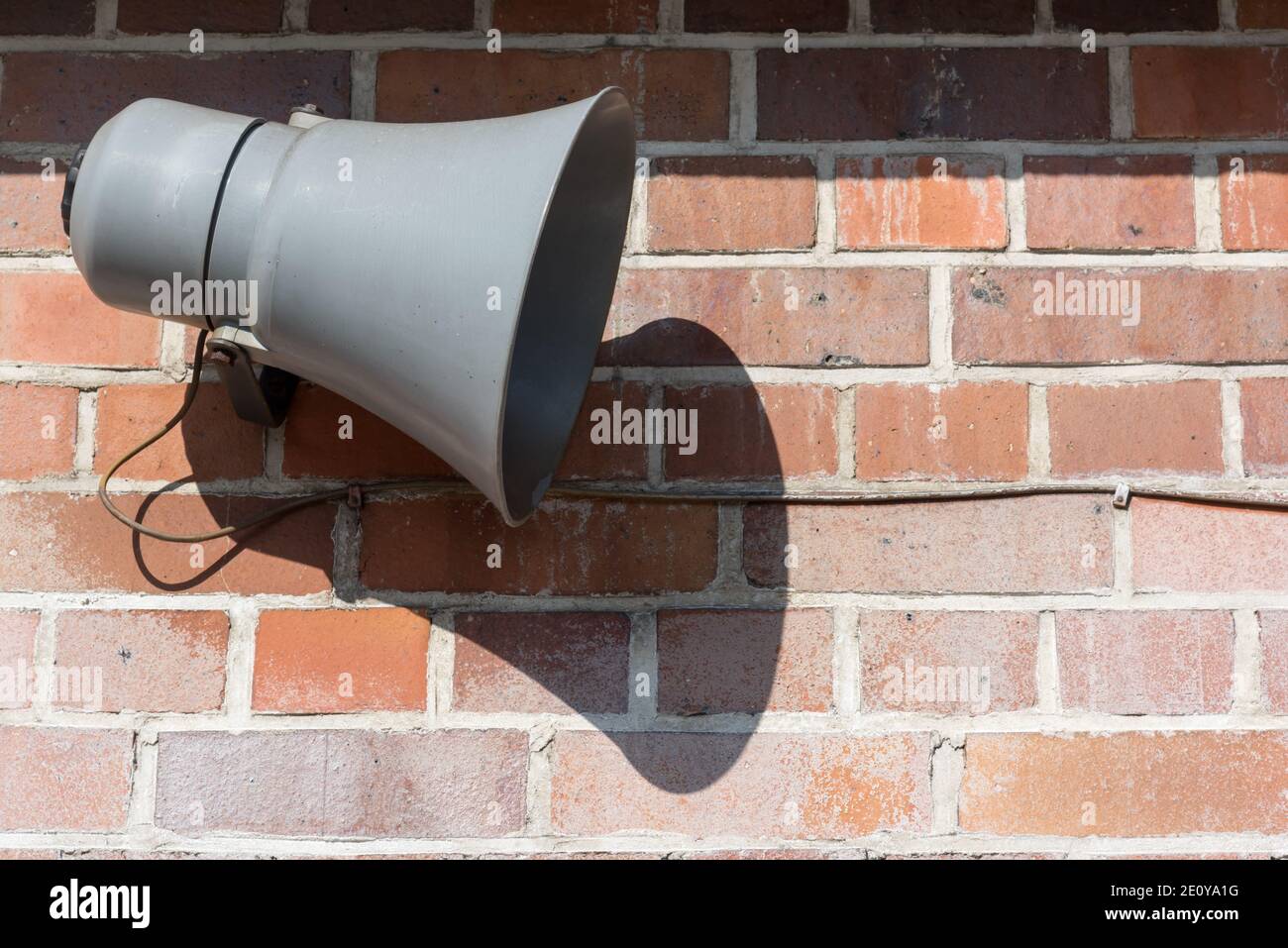 Megaphone in front of an old brick wall Stock Photo - Alamy
