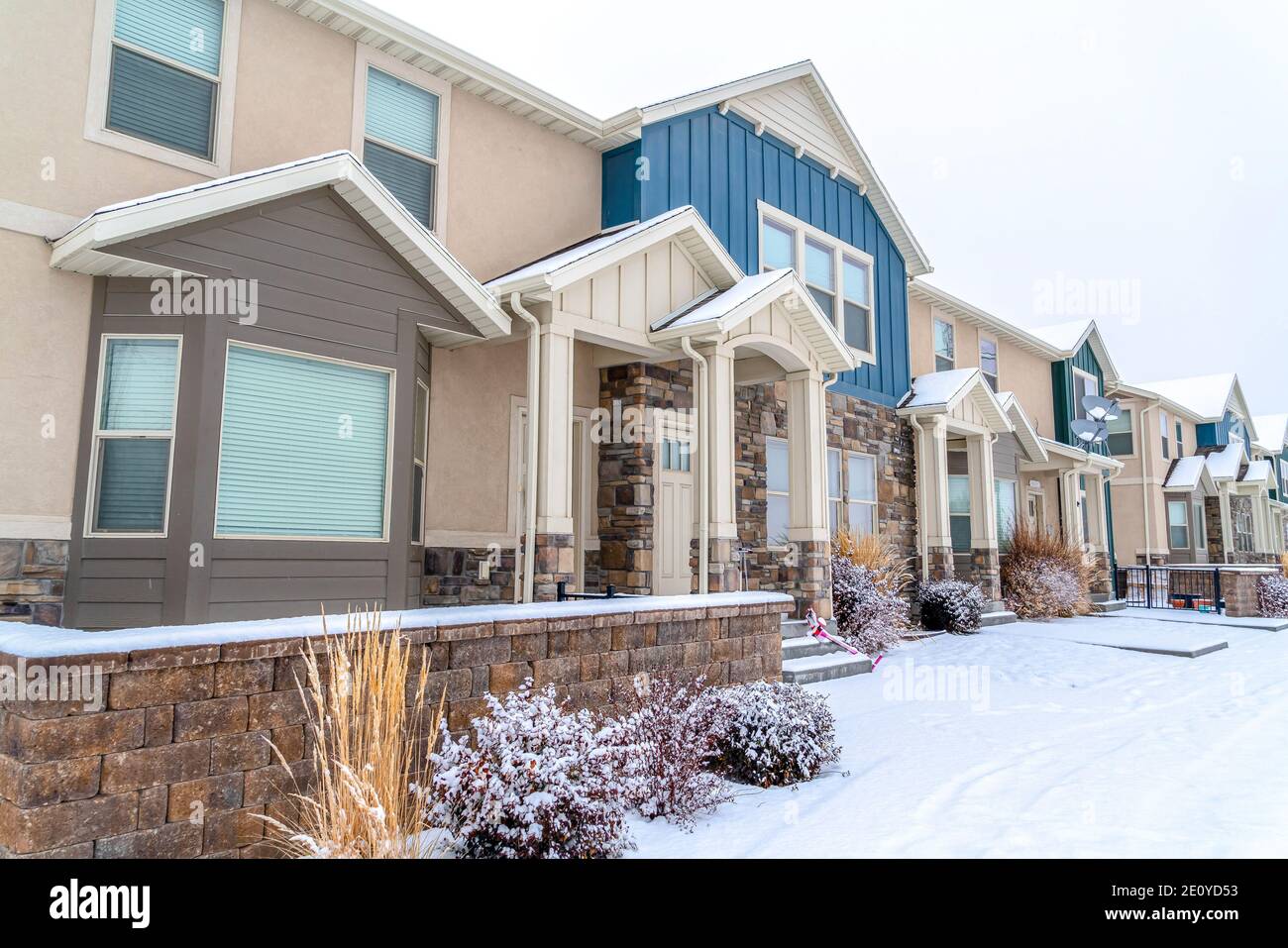 Two storey homes with bay windows porches and gabled entrances at the ...