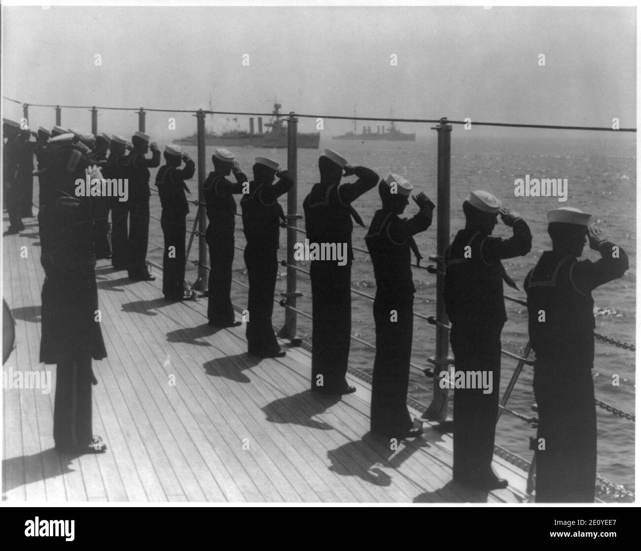 Line of sailors along ship railing giving hand salute. ca. 1913-1921 ...