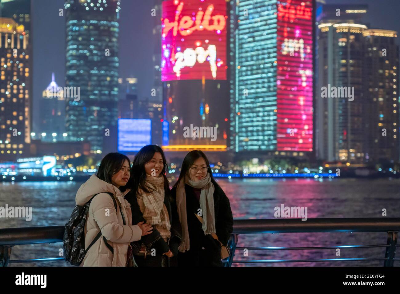 Shanghai. 2nd Jan, 2021. People pose for a photo at the Bund in east ...