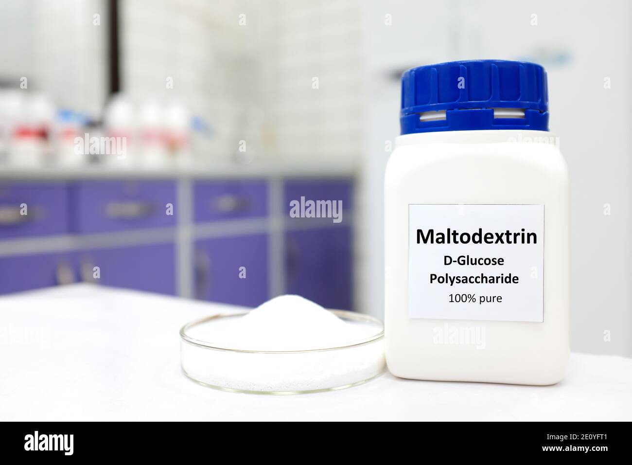Selective focus of a bottle of pure maltodextrin with powder in petri ...