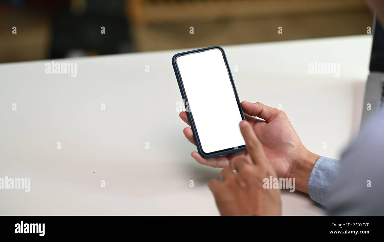 Close up view of male hands using smartphone with blank screen for ...