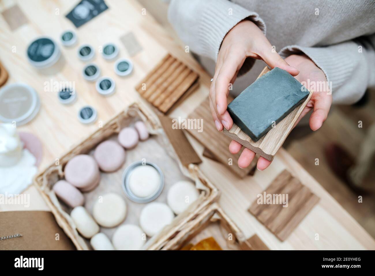 Female hands holding eco soap and wooden soap dish. Overhead view Stock ...