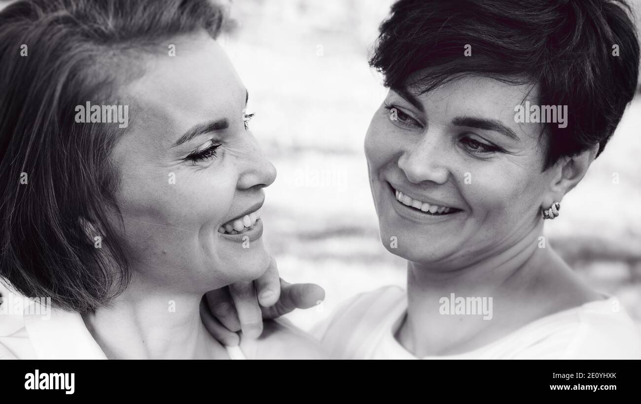 Warm female friendship and mutual understanding. The two women embrace ...