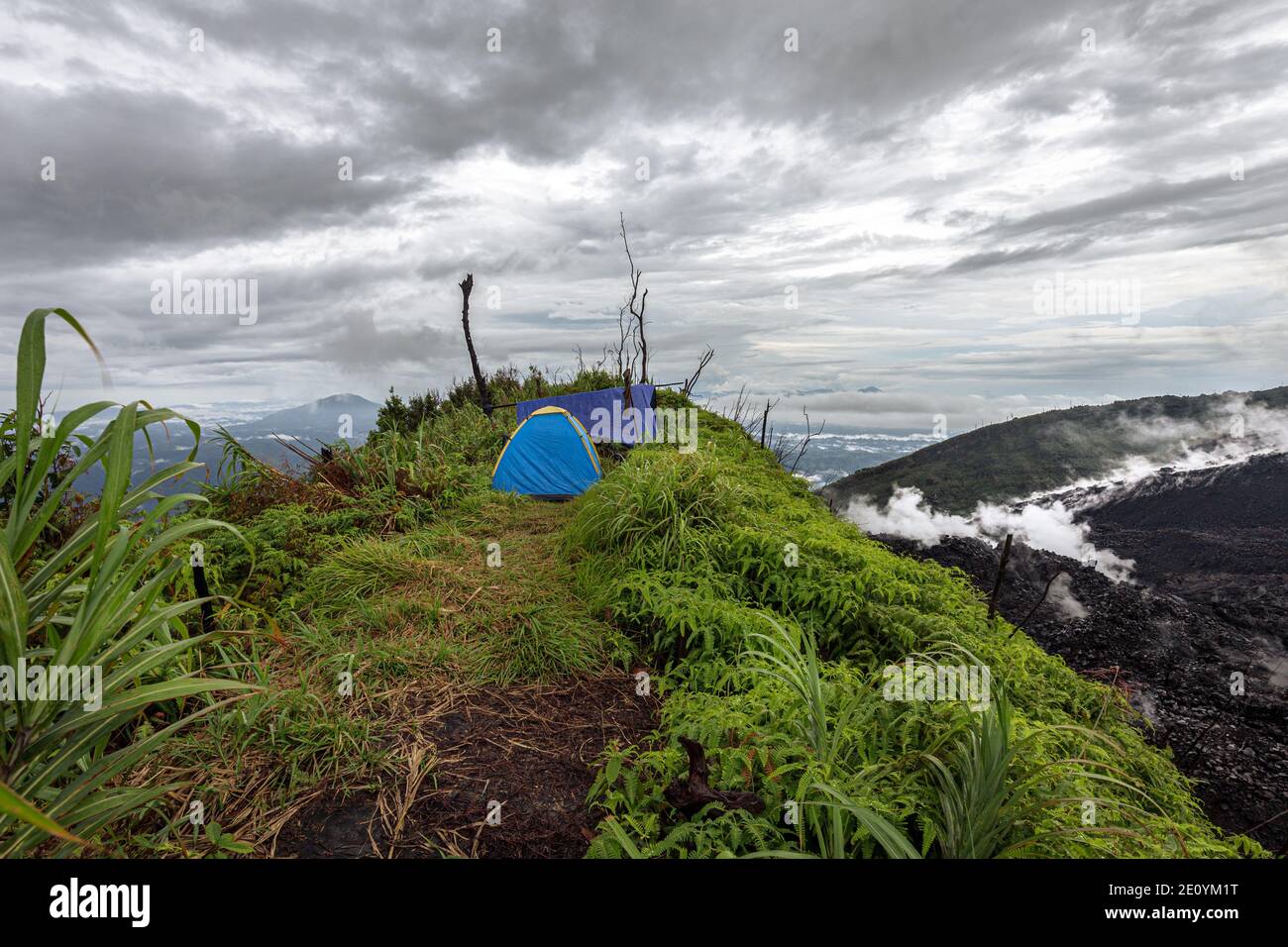 Camping on the crater rim of Ibu volcano on Halmahera, Indonesia Stock ...