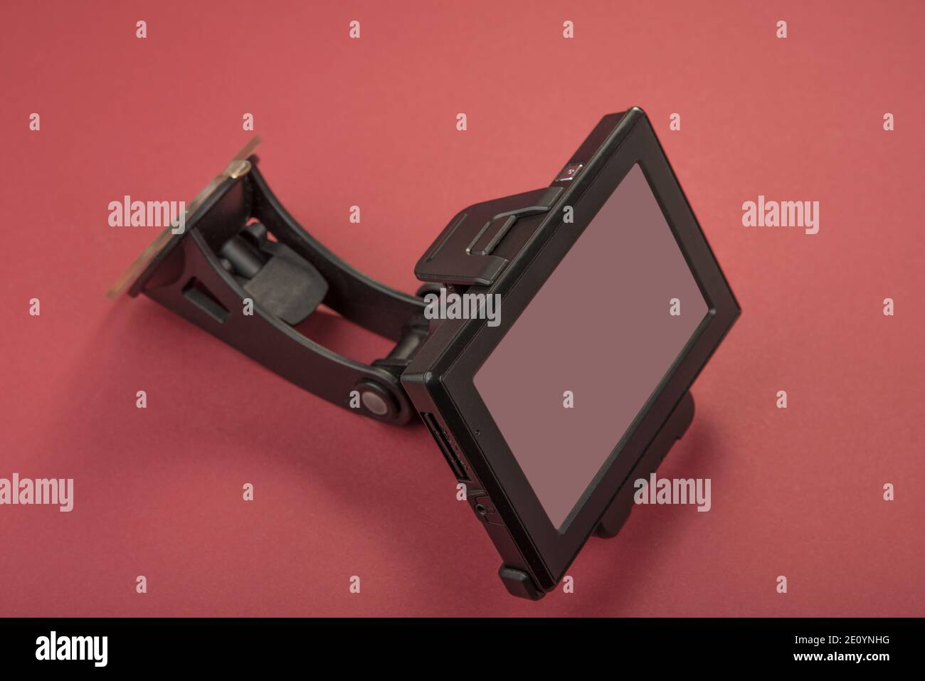 Old GPS navigation on a red background Stock Photo - Alamy