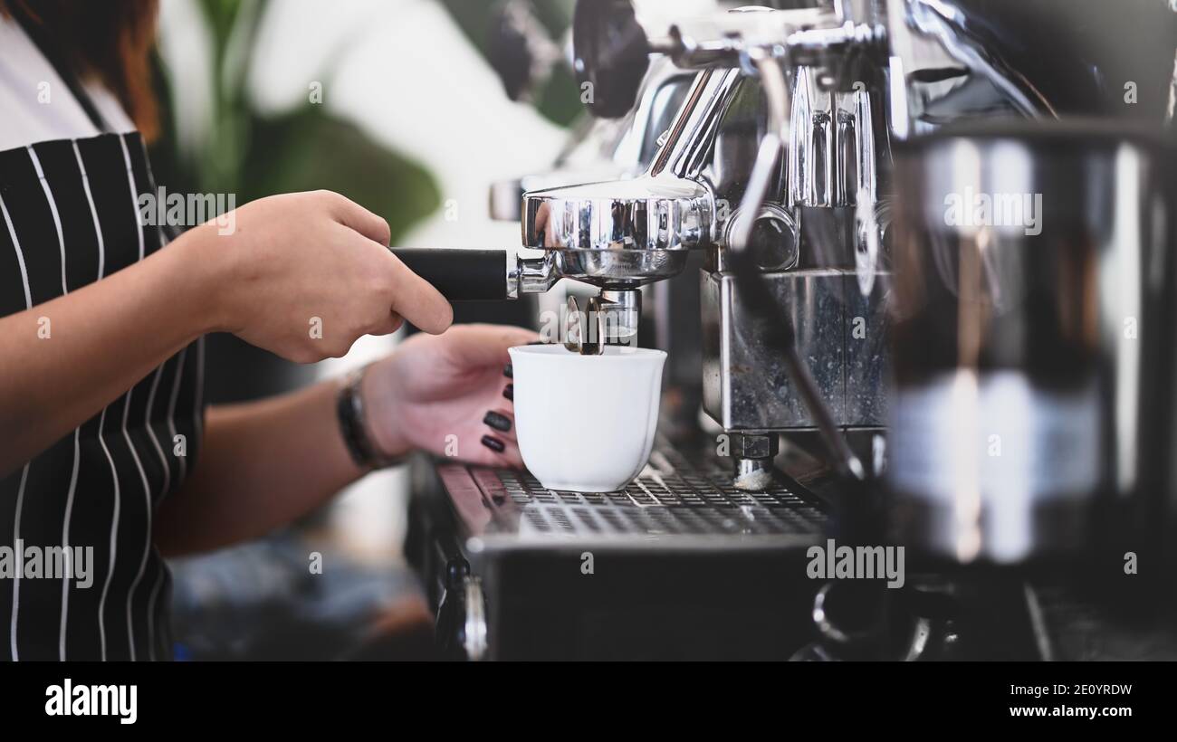 Close up view of barista hands using coffee machine for making coffee in the cafe Stock Photo ...
