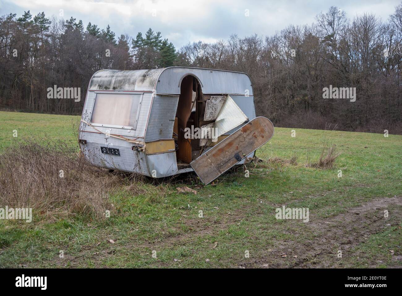 Ruined trailer on the meadow by the forest Stock Photo - Alamy