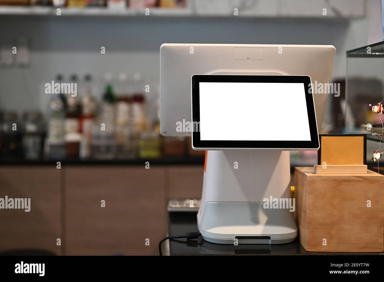 A touchscreen cashier machine with blank screen at modern coffee shop ...