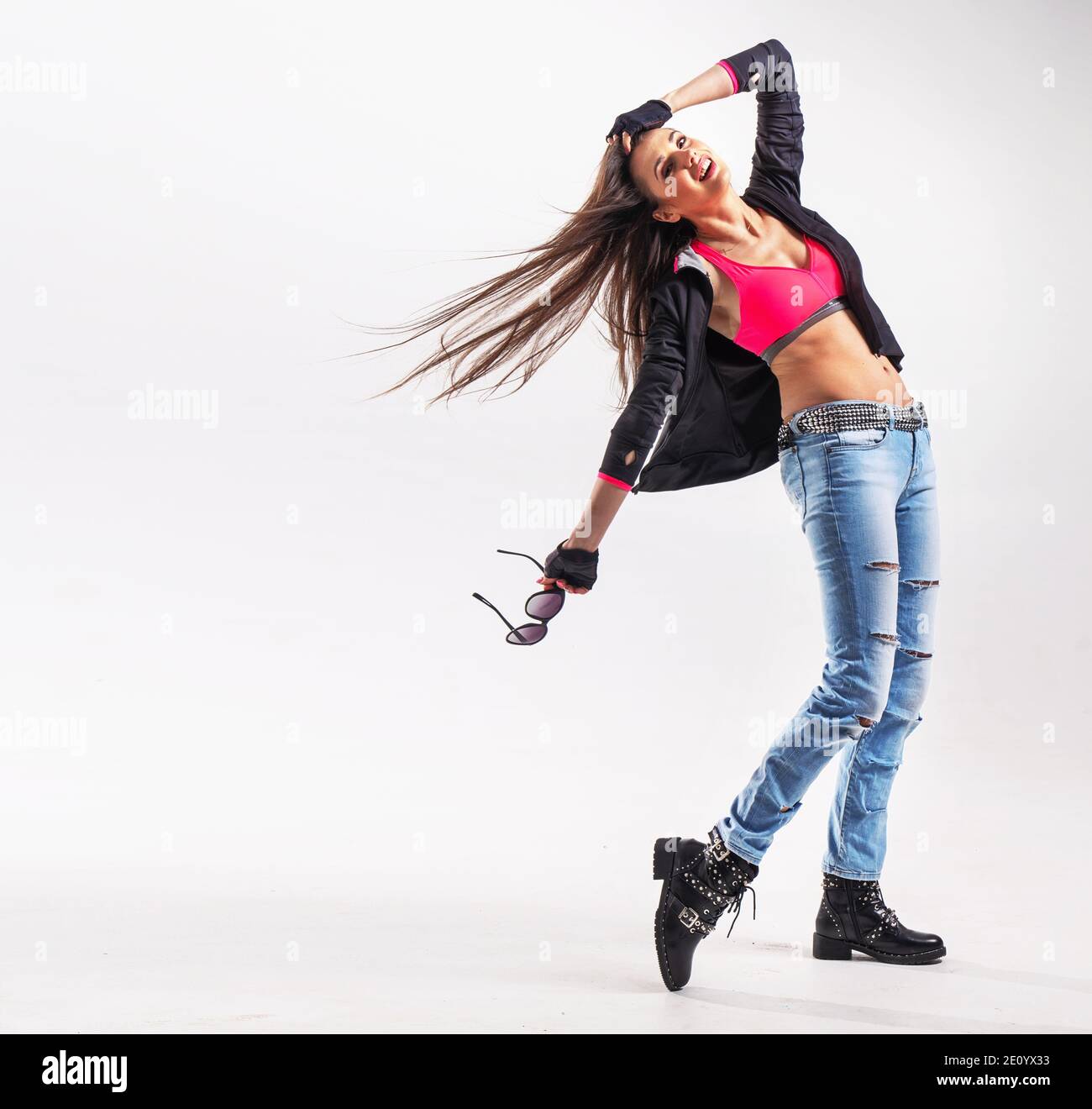 Young, pretty dancer wearing the rebelious outfit Stock Photo - Alamy