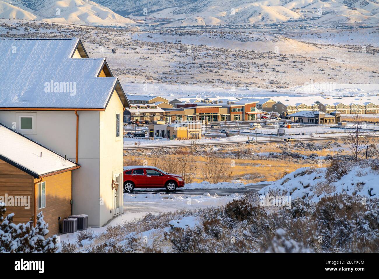 Frosty neighborhood landscape with snowy mountain view on a sunny ...