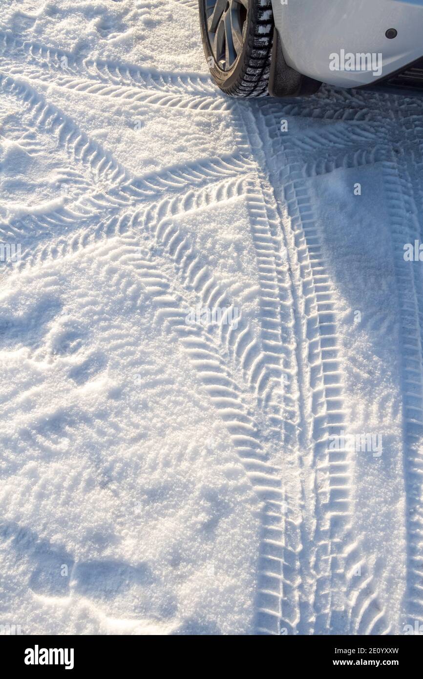 Car tire tracks in the snow close-up Stock Photo - Alamy