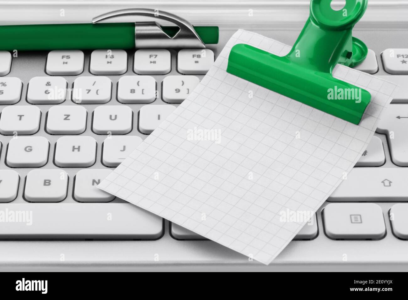 Green business background with PC keyboard Stock Photo - Alamy
