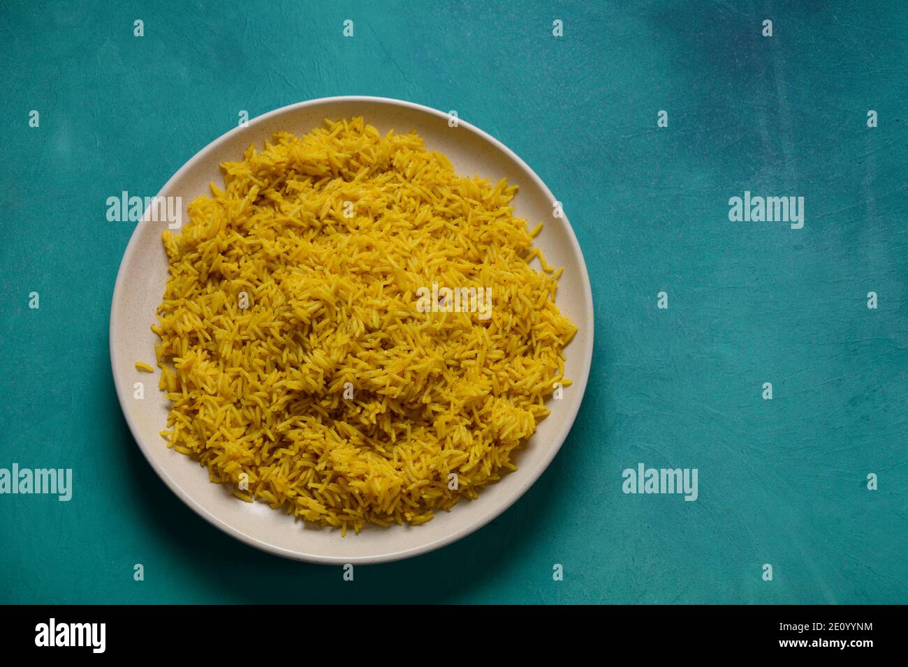 Yellow wild rice cooked with curcuma turmeric spice Stock Photo - Alamy