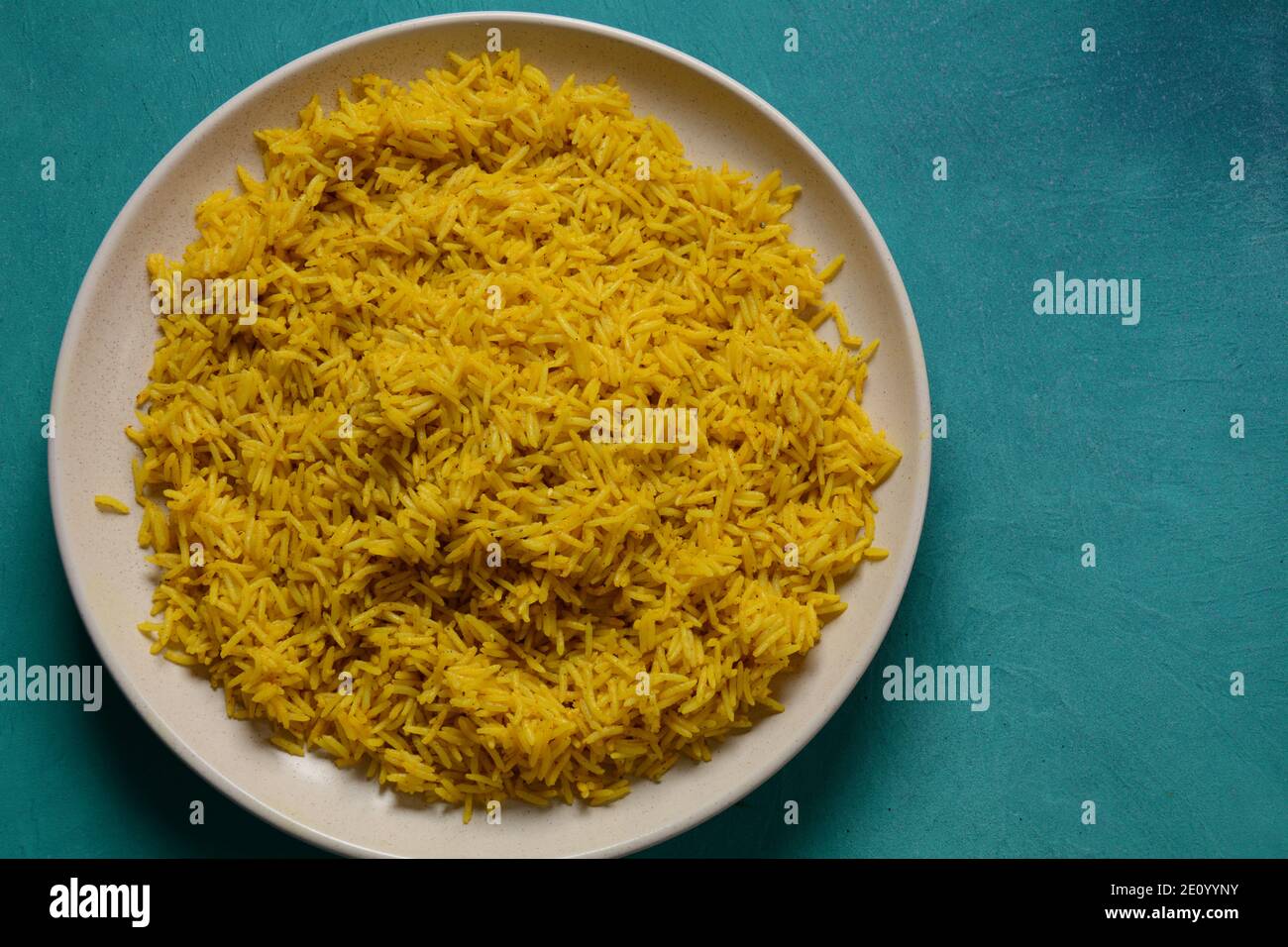 Yellow wild rice cooked with curcuma turmeric spice Stock Photo - Alamy