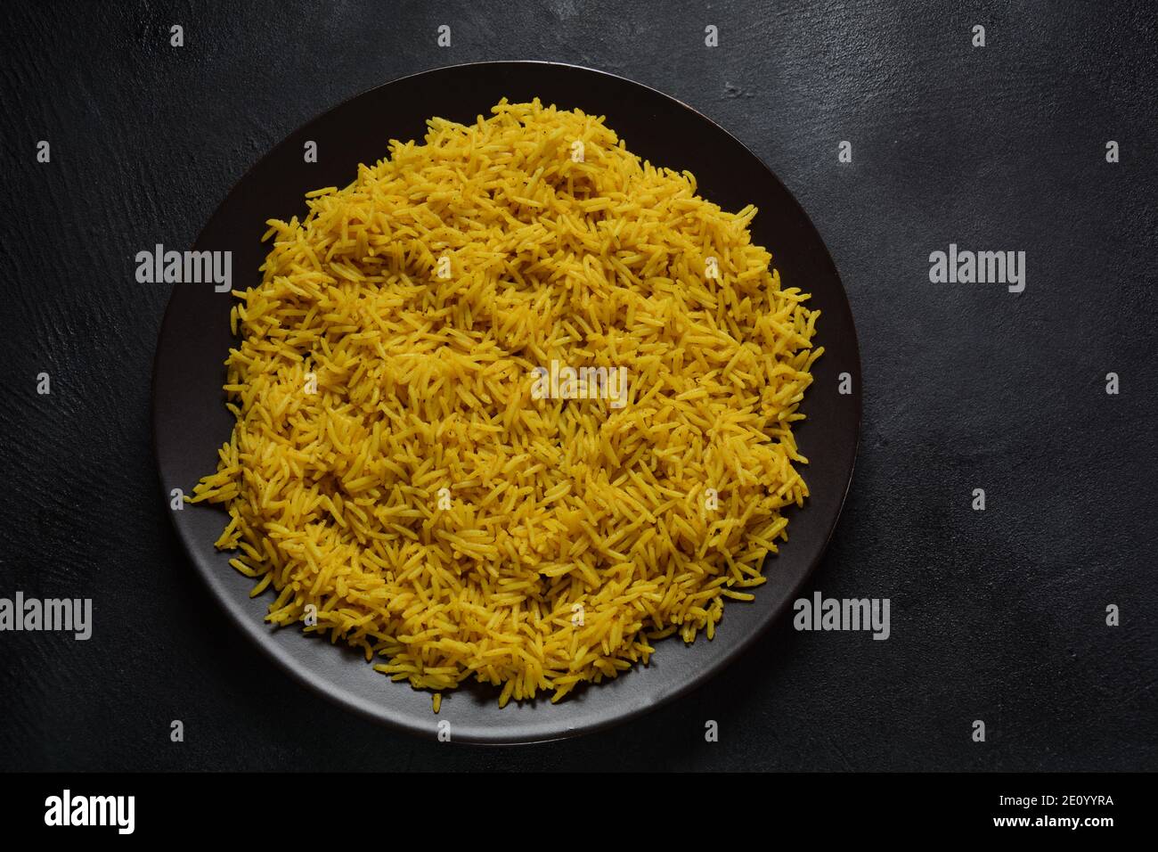 Yellow wild rice cooked with curcuma turmeric spice Stock Photo - Alamy