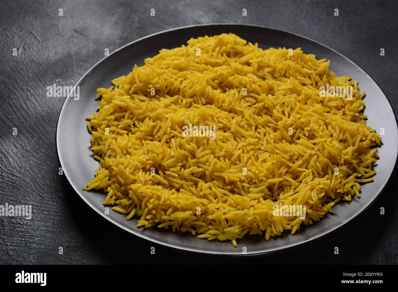 Yellow wild rice cooked with curcuma turmeric spice Stock Photo - Alamy