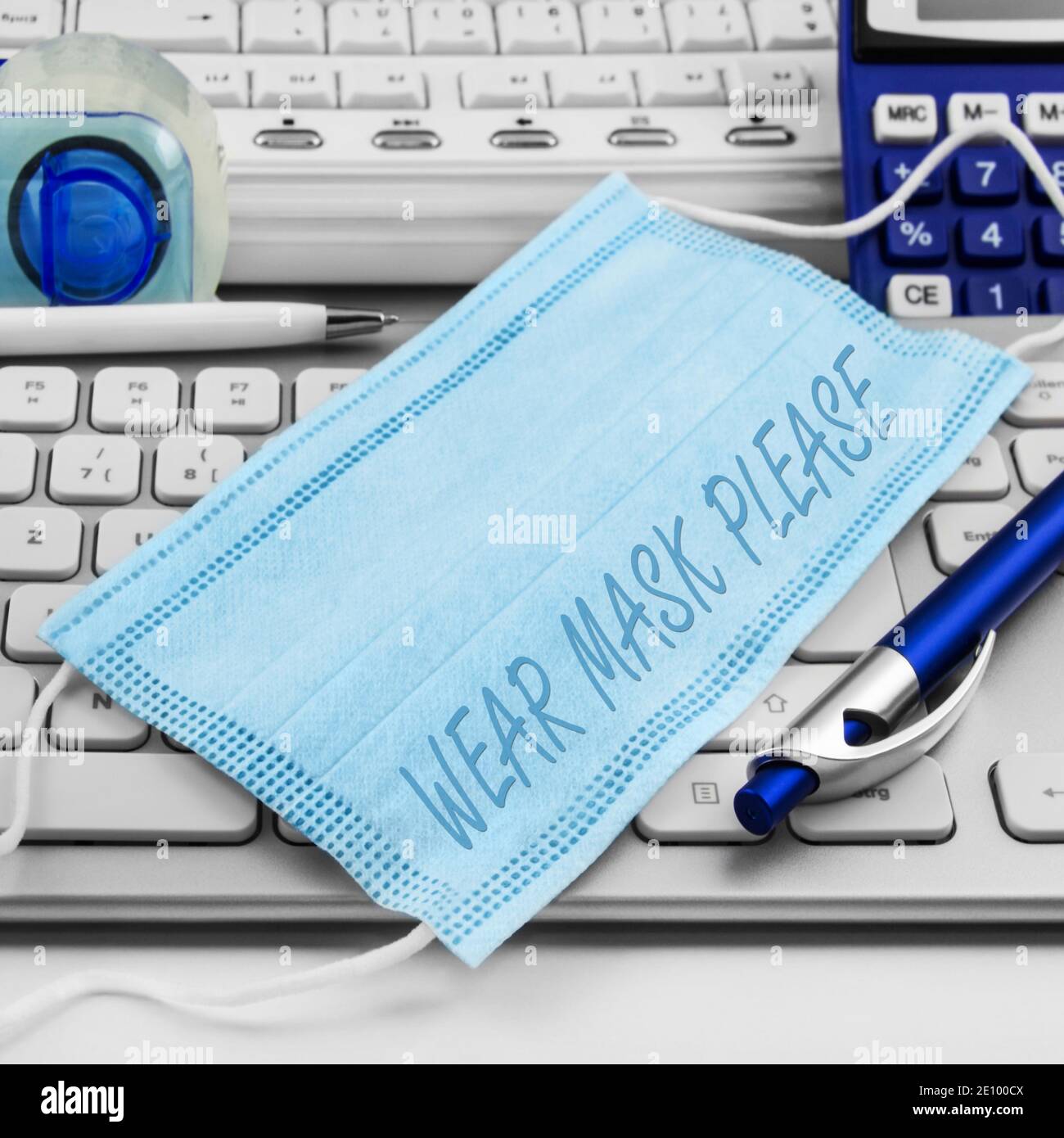 Face mask and office background with PC keyboard Stock Photo - Alamy