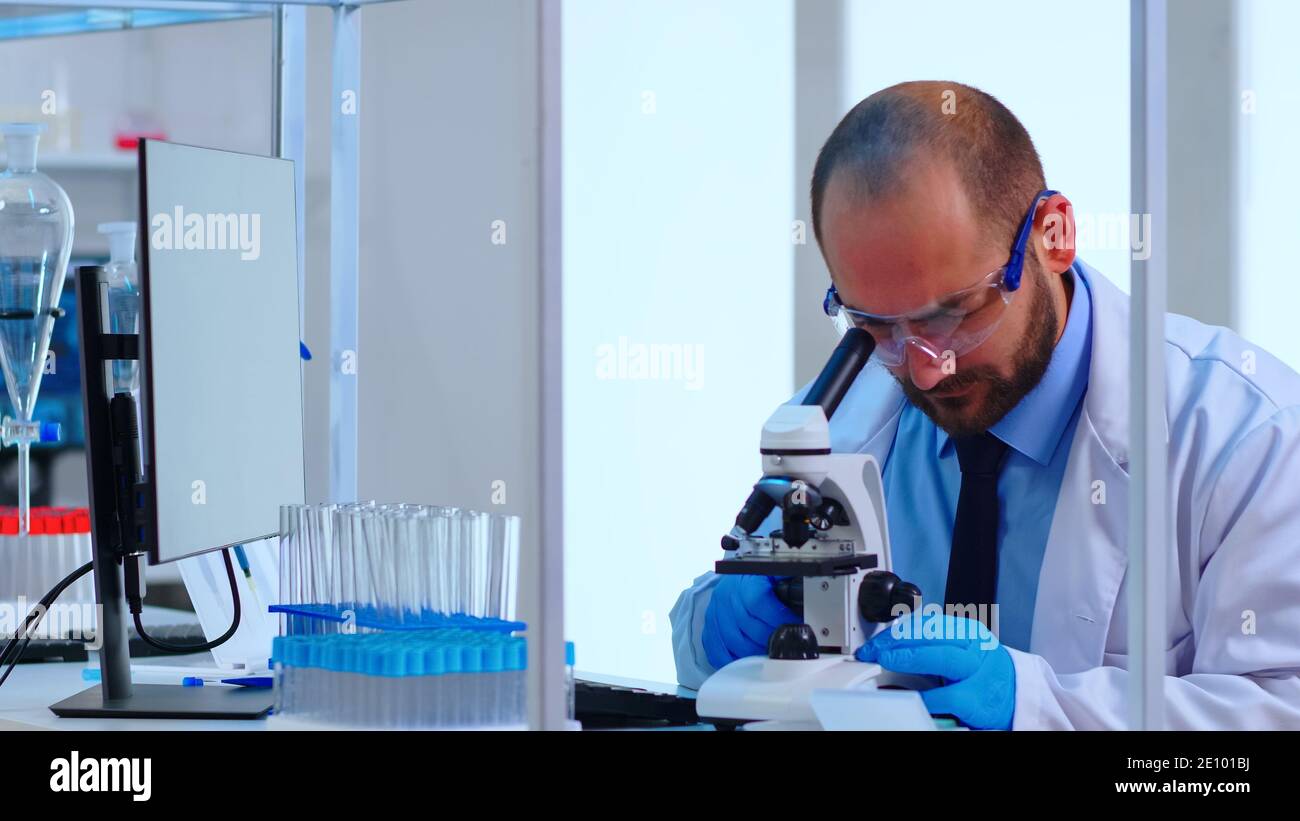 Medical research scientist conducting vaccine development under digital ...