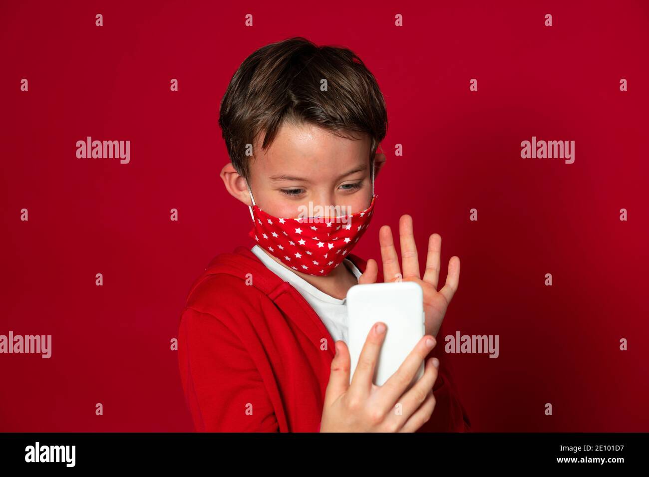 cool young schoolboy with mask and smartphone Stock Photo - Alamy