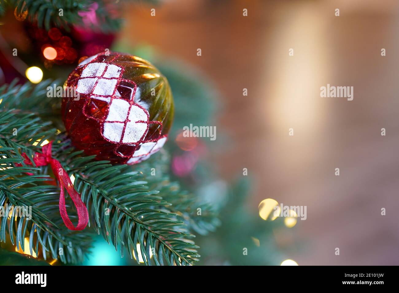 Christmas background - red ball on green branch of spruce tree Stock ...