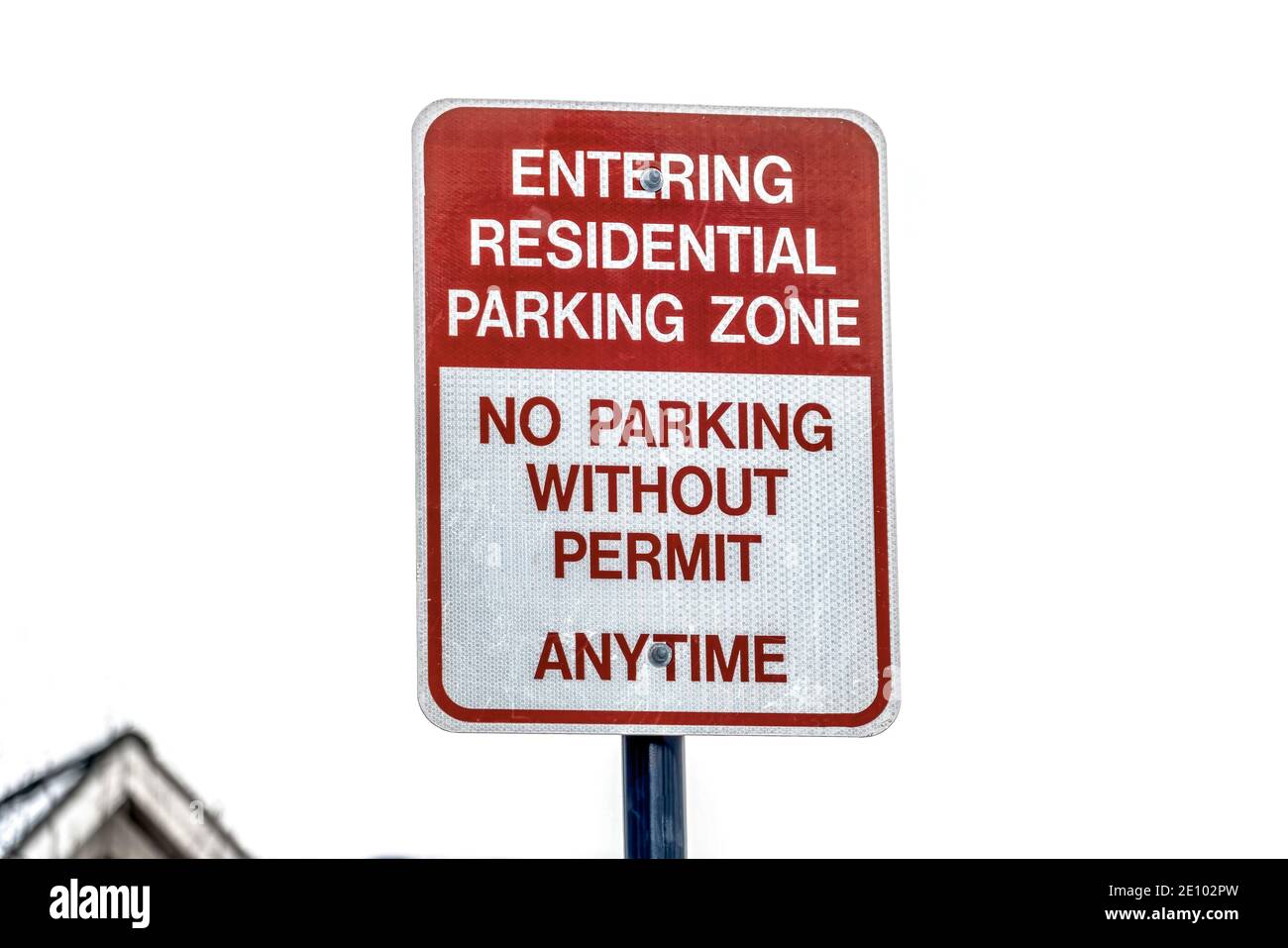 No Parking Without Permit Anytime sign against white cloudy sky ...