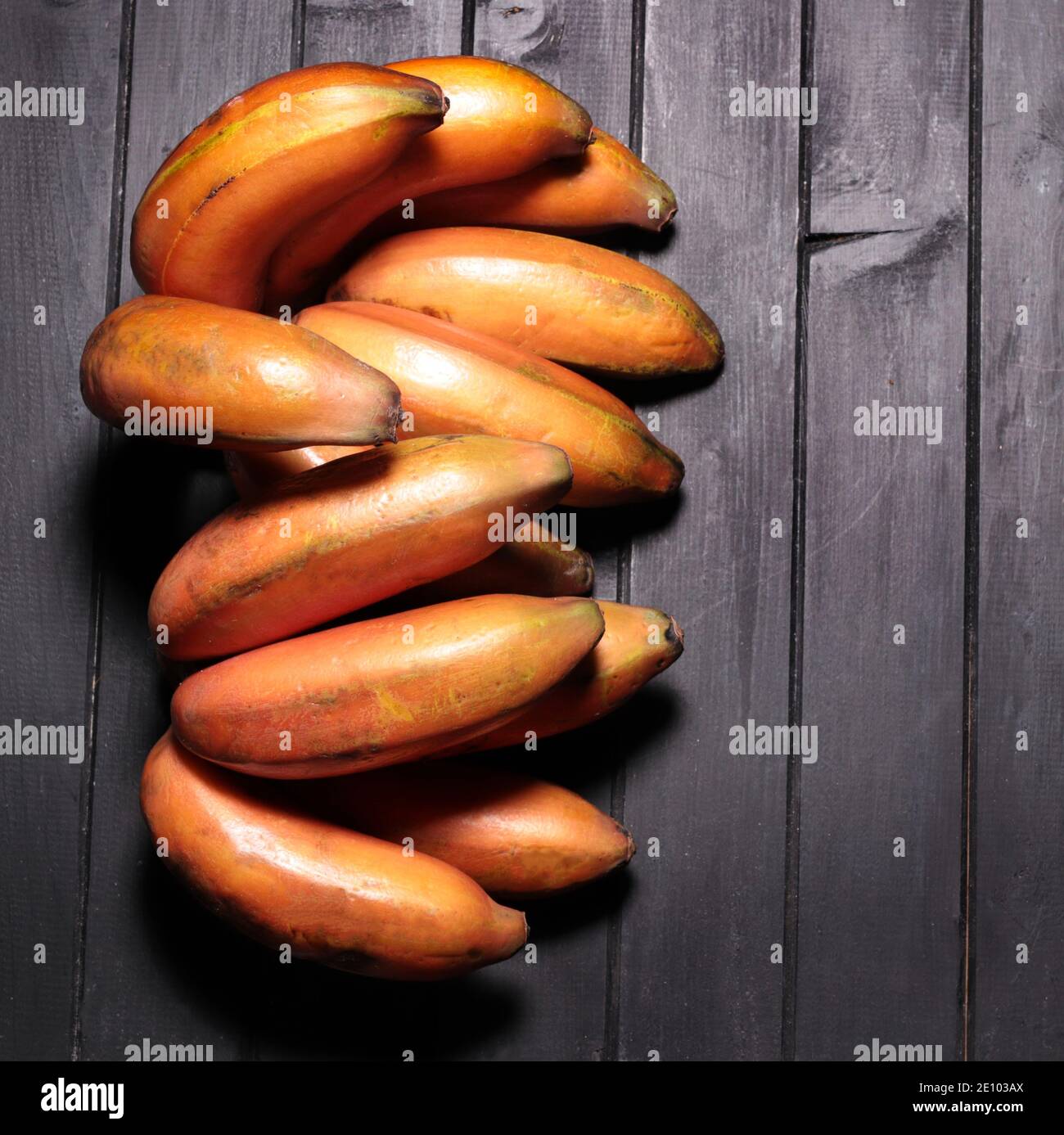 Fresh red banana isolated on dark background. View from above. 'Red ...