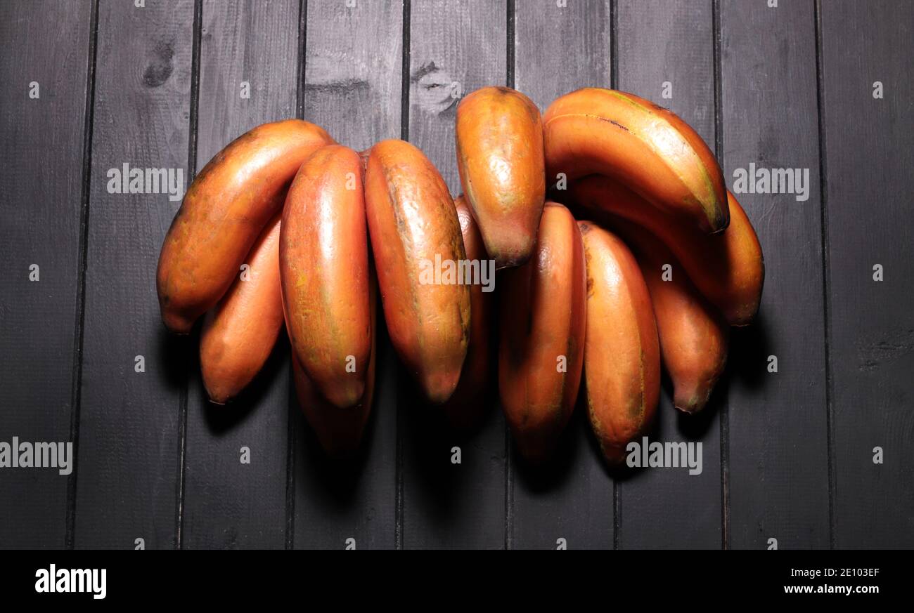 Fresh red banana isolated on dark background. View from above. 'Red ...