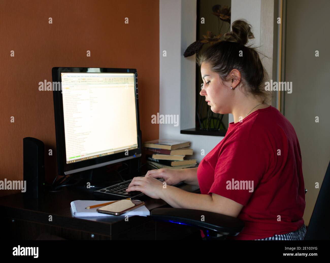Young woman works on the computer hi-res stock photography and images ...