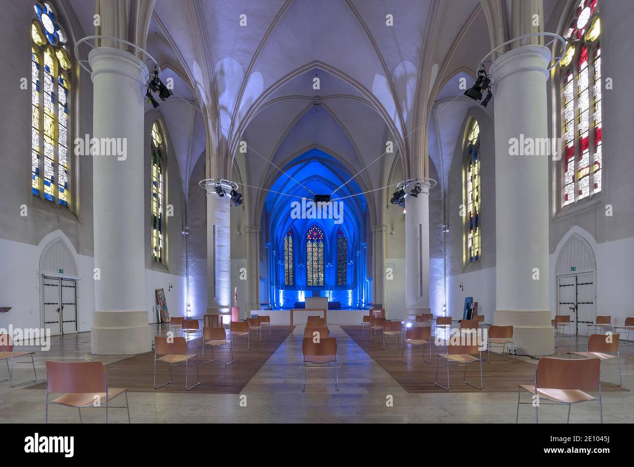 Colorfully illuminated altar room in the church of St. Martini, Münster ...