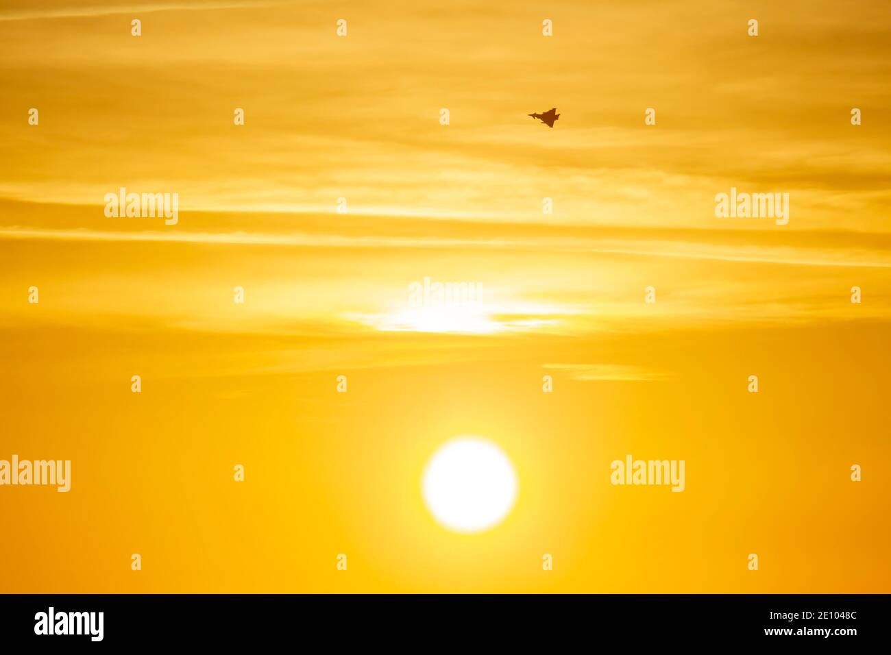 Eurofighter Typhoon aircraft in flight of the Royal air force at sunset ...