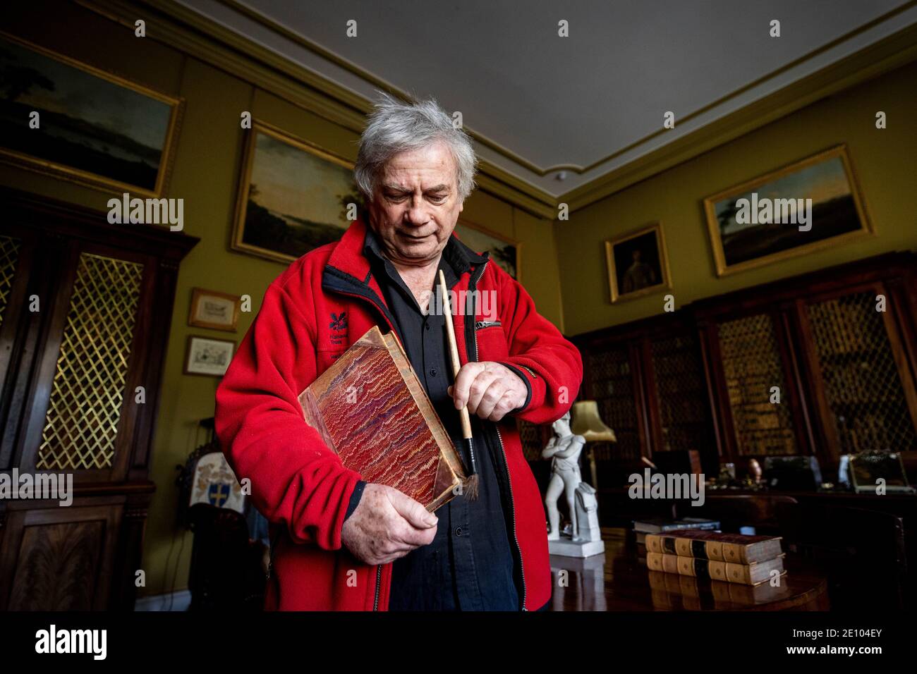 National Trust Castle Ward Collections Assistant Martin Gibson, gently ...