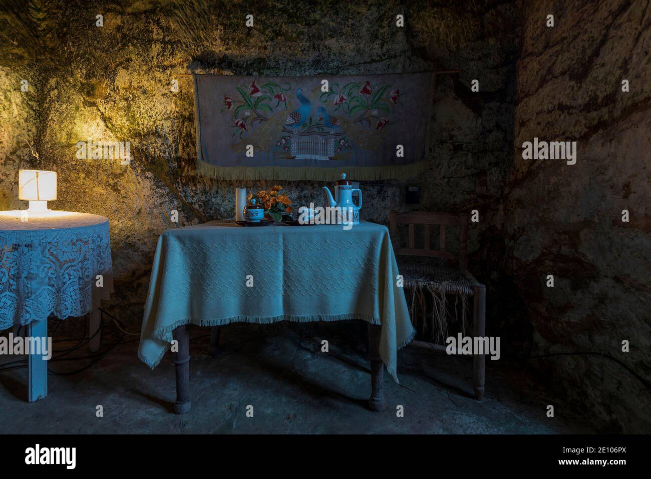 Set table and chair in a cave dwelling, Langenstein cave dwellings ...