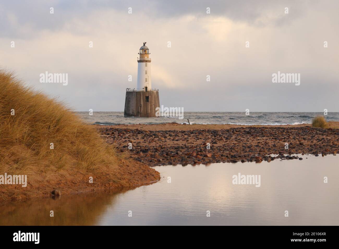 White lighthouse in sea Stock Photo - Alamy