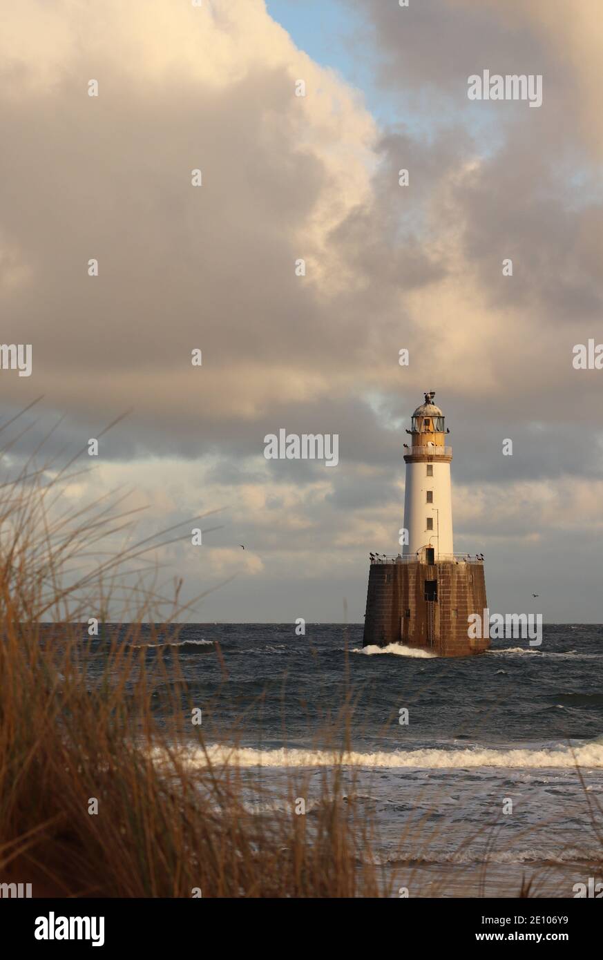 White lighthouse in sea Stock Photo - Alamy